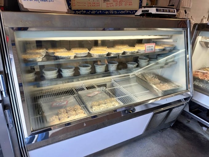 The display case of dreams—where crab cakes await their lucky new owners. Each container holds enough crab meat to make a mermaid jealous.