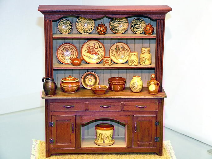 This miniature hutch displays pottery so perfectly scaled you'd think elves moonlight as master ceramicists during their off-hours from making cookies.
