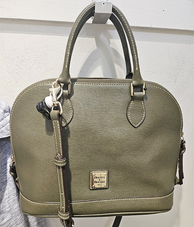 This Dooney & Bourke in olive isn't just arm candy—it's a statement piece that whispers "savvy shopper" to everyone who compliments it.