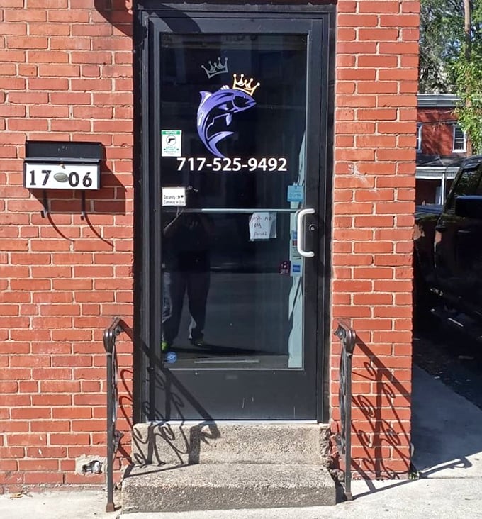 Even the entrance knows what's important—a crowned fish logo announcing you're about to enter seafood royalty territory.
