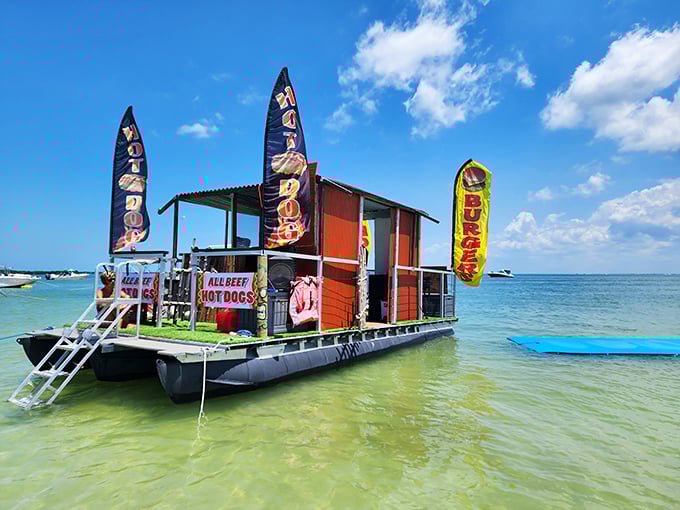 Floating fast food with flair! This clever entrepreneur brings burgers and dogs directly to hungry boaters – genius business model.