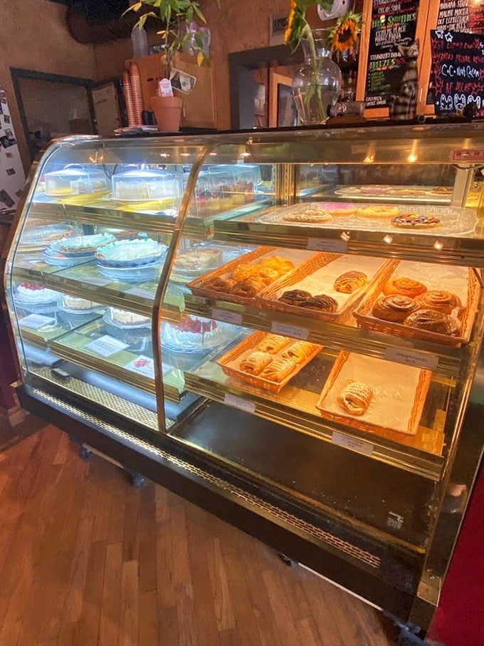 Fresh-baked temptations await under glass domes – resistance is futile, surrender is delicious.