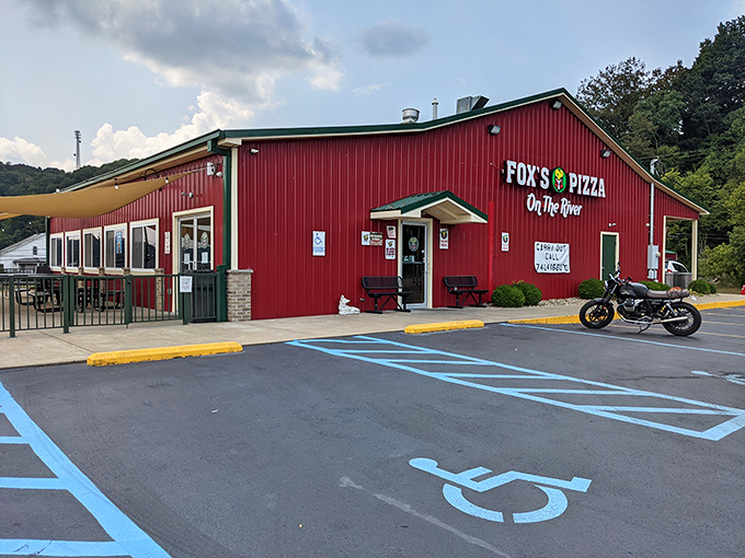 Fox's Pizza's bold red exterior makes no apologies for being exactly what it is—a beloved local pizza joint where river views come standard with your pepperoni.
