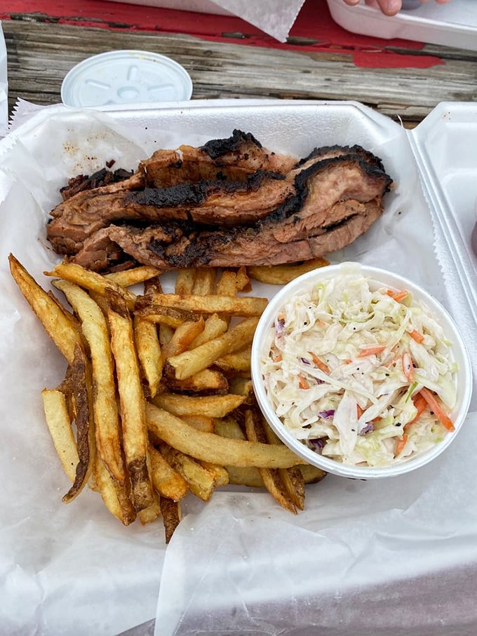 Proof that sometimes the best things come on paper, not plates. This brisket and fries combo makes a mockery of fancy dining with its honest, unpretentious perfection.