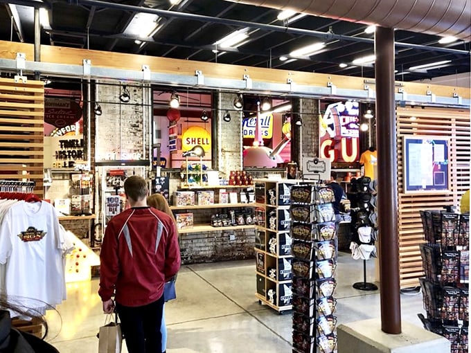 Shopping for souvenirs beneath the glow of Shell and GE signs—because regular gift shops are just too... well... unilluminated.