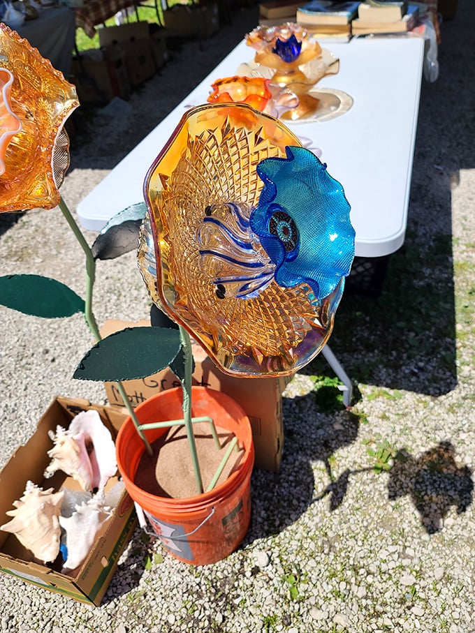 Colorful glass art transforms everyday garden décor into something that catches sunlight like a kaleidoscope came to life.
