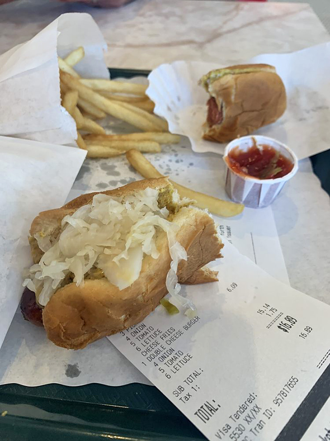 The hot dog with sauerkraut and receipt—proof that culinary joy doesn't require a three-figure check or a reservation made months in advance.