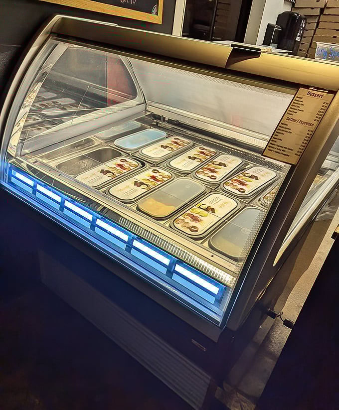 This gelato display case is the adult equivalent of a toy store window—colorful, tempting, and guaranteed to make you forget you were "too full for dessert."