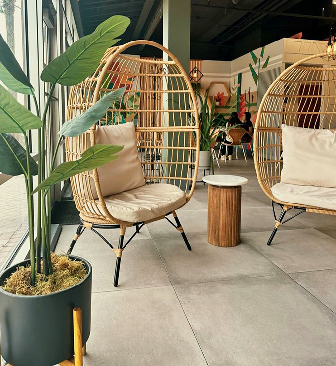 These egg-shaped chairs aren't just seating; they're cocoons of comfort where coffee conversations can safely hatch into full-blown friendships.