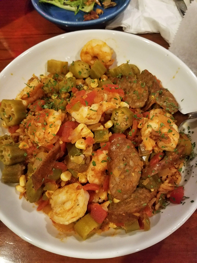 Jambalaya that's a party in a bowl—shrimp, sausage, and vegetables dancing in spicy harmony. The Mardi Gras of main courses.