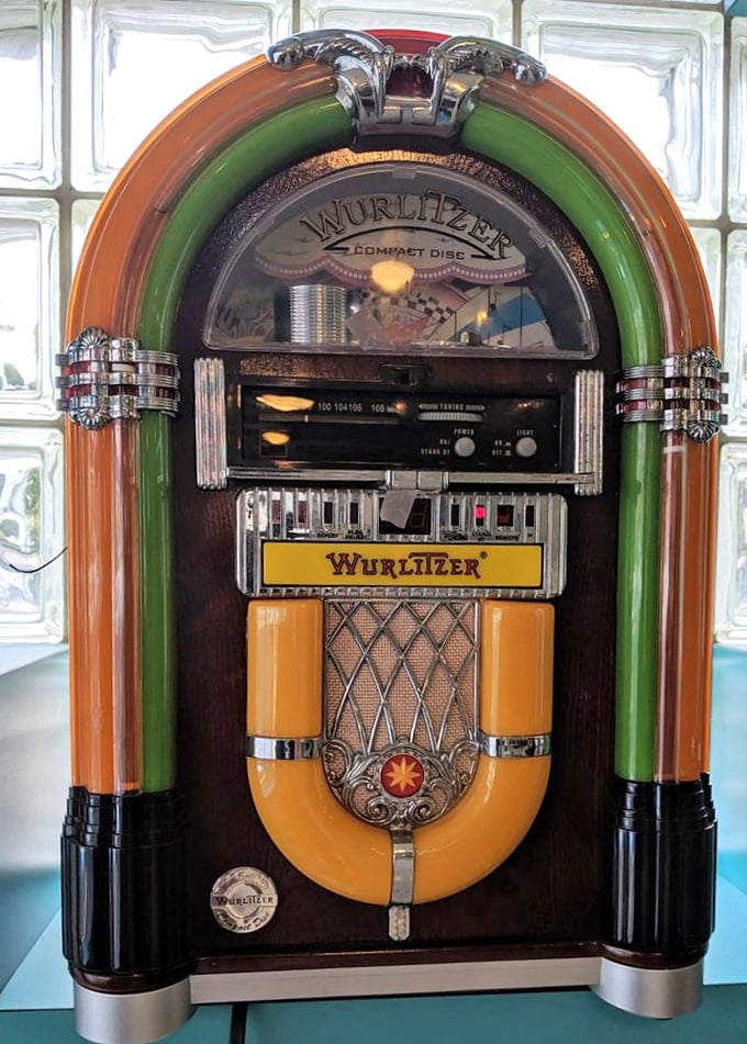 The vintage Wurlitzer jukebox stands ready to provide the soundtrack to your meal—no music streaming subscription required.