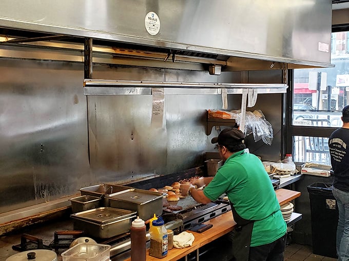 The kitchen dance – where cooks navigate tight quarters with the precision of choreography, turning simple ingredients into diner magic.