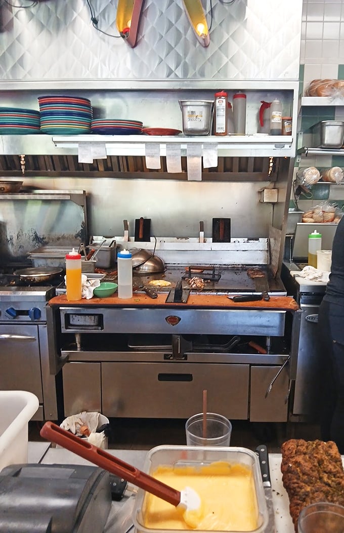 The open kitchen concept lets you watch your meal's journey from ingredients to masterpiece—dinner and a show!