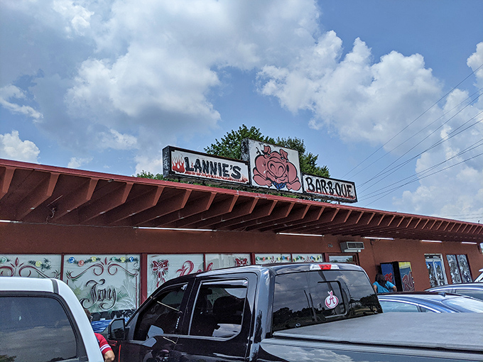 Lannie's Bar-B-Q's colorful exterior hints at the flavor explosion waiting inside—where smoke, spice, and Southern tradition meet.
