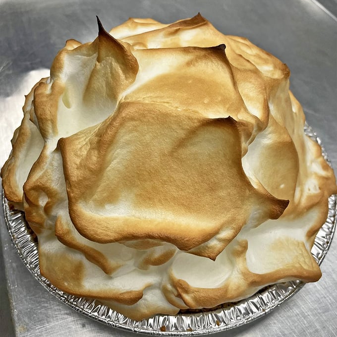 Meringue peaks toasted to perfection atop tangy lemon filling. This pie doesn't just end a meal—it's the grand finale that steals the show.