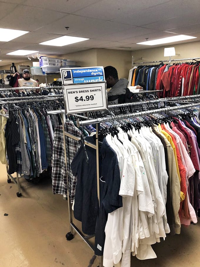 Men's dress shirts hang in pristine formation at $4.99 each, proving that looking like a million bucks doesn't have to cost more than a fancy coffee.