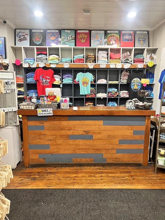 The merch wall that says, "Yes, this place is good enough that people actually want to wear t-shirts advertising it."