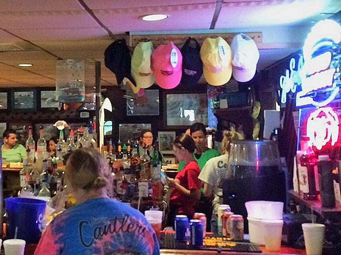 The bar area where locals swap fishing tales and newcomers quickly become regulars. Cold beer and warm conversation flow freely.