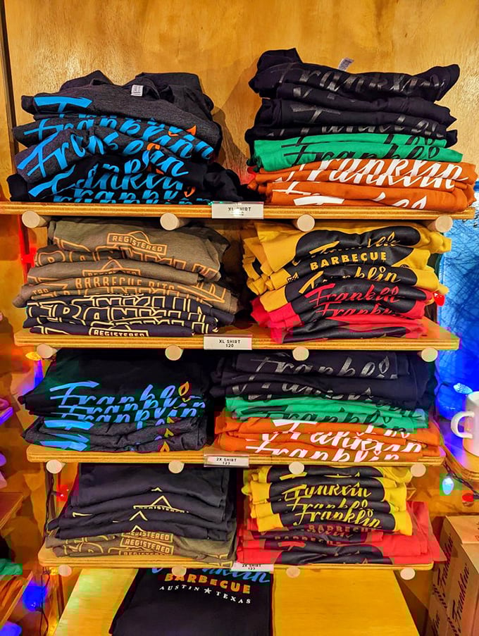 The merchandise wall—because sometimes a t-shirt is the only way to prove to friends back home that yes, you really did make the pilgrimage.
