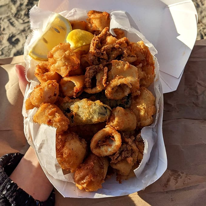 Mini fish trap tempura—bite-sized pieces of joy that prove sometimes the best seafood experiences come in small, perfectly crispy packages.