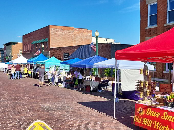 Farmers markets under colorful tents on brick streets—this is how shopping for vegetables should always feel, minus the fluorescent lighting.