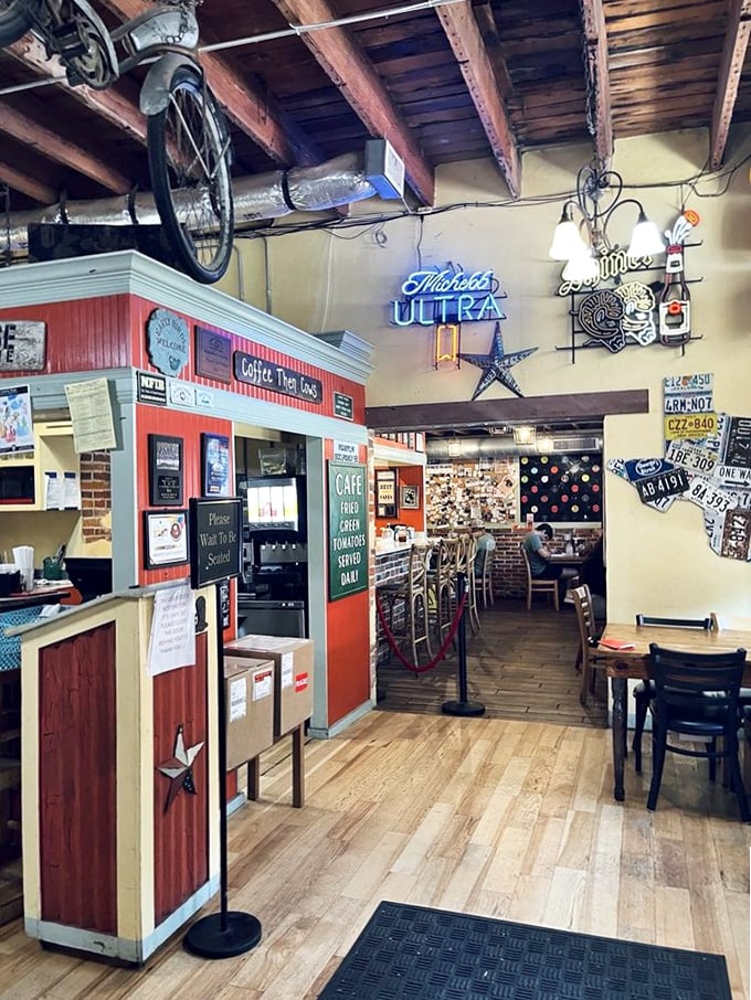Where magic happens: vintage signs, exposed beams, and a layout that somehow makes strangers feel like neighbors sharing the same delicious secret.