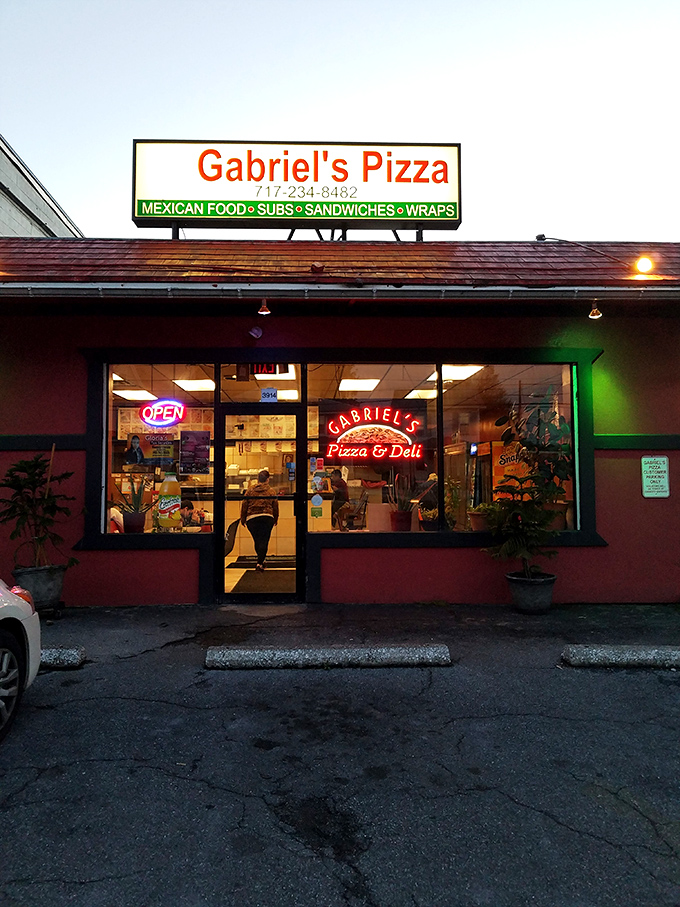 As dusk falls, Gabriel's neon glow becomes a beacon for the hungry. The pizza equivalent of "I'll leave the light on for you."
