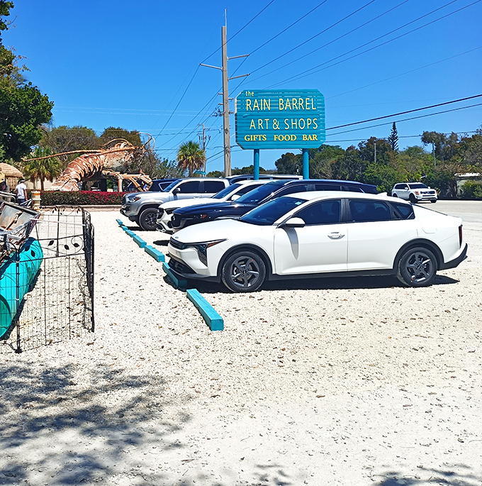 The parking lot view reveals what every Florida road-tripper hopes to find—a yellow sign promising art, food, and the unexpected.