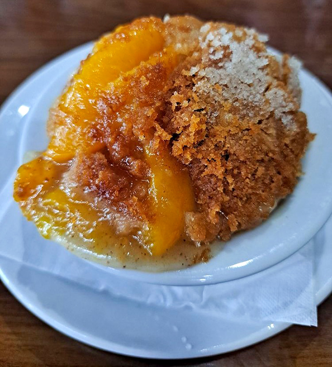 Peach cobbler glistening under its sugary crust – Georgia's state fruit getting the royal treatment it deserves.