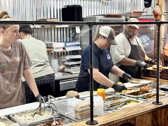 Behind the scenes where magic happens—skilled hands transforming humble ingredients into edible poetry. The assembly line of joy.