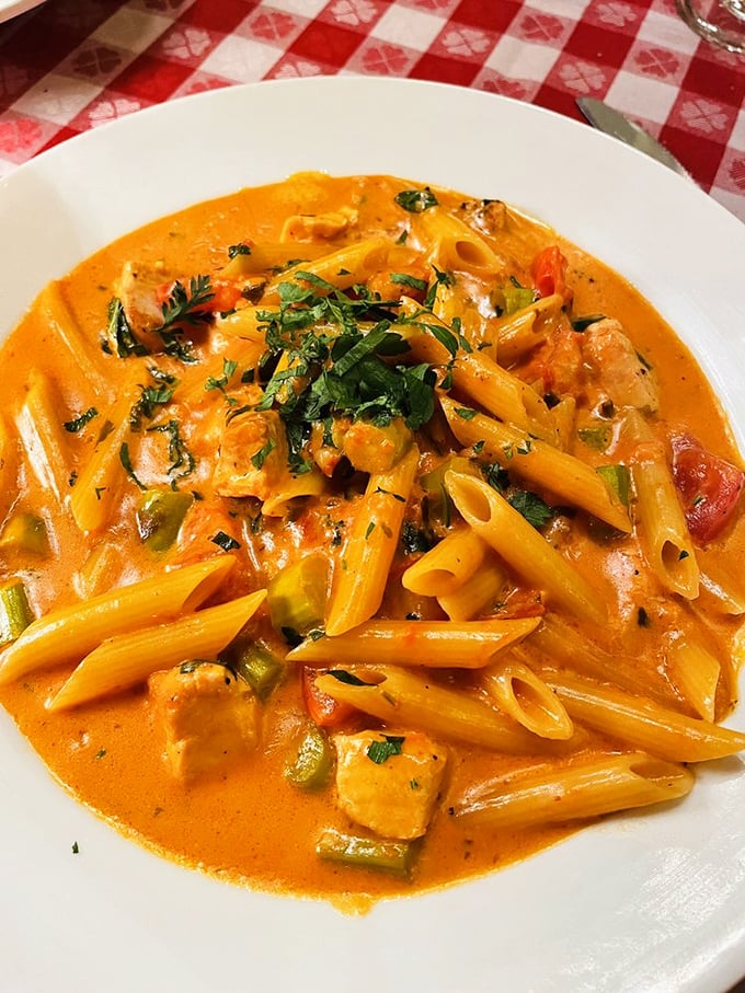 This pasta doesn't just have sauce—it's having a full-blown love affair with it, each penne coated in a rich, creamy embrace.