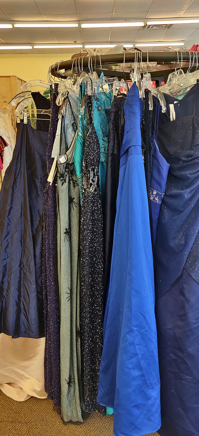 A rainbow of formal dresses waiting for their second chance to shine – each one holding the echoes of proms and weddings past.