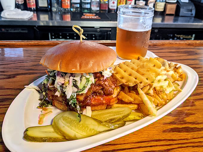 This pulled pork sandwich isn't just food – it's an edible hug on a brioche bun, complete with the kind of slaw that makes vegetables worth eating.