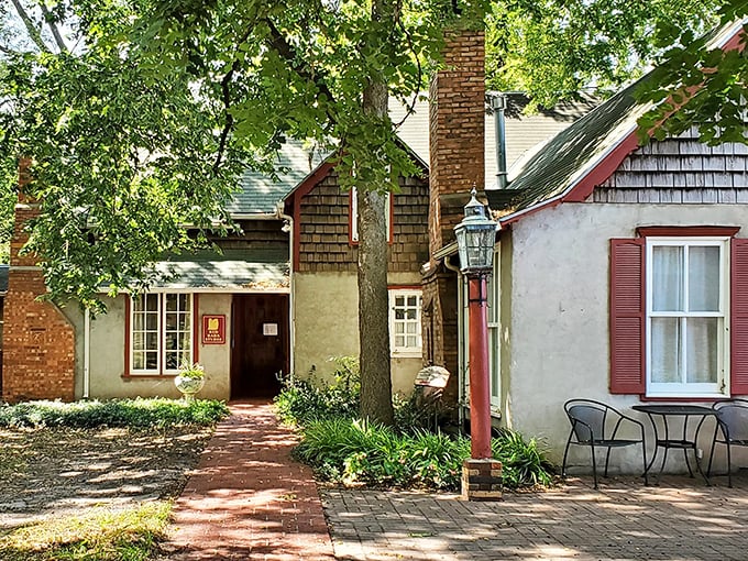 The Red Barn Studio Museum's humble exterior belies the creativity within – like finding an artistic oasis tucked behind a garden path.