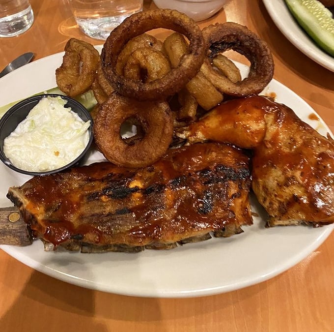The indecision-solver plate: ribs AND chicken together at last. Like Batman meeting Superman, but with more napkins and no cape-envy.