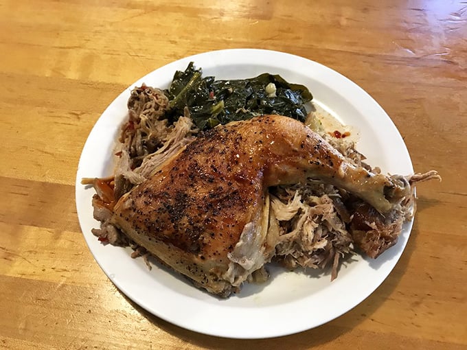 This roasted chicken quarter lounging on a bed of pulled pork is the power couple of protein that your taste buds have been waiting to meet.