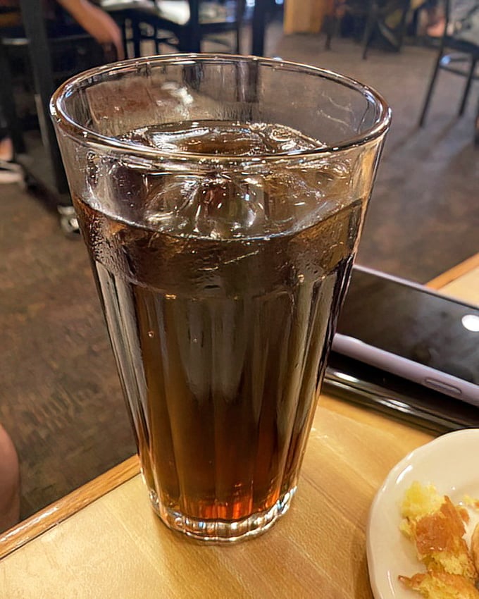 Root beer in a proper glass—dark, fizzy, and nostalgic—the kind of simple pleasure that makes you slow down and appreciate the moment.