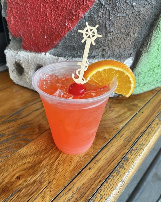 This rum runner isn't just a cocktail—it's Florida sunshine in liquid form, complete with a ship's wheel to steer your afternoon into relaxation.