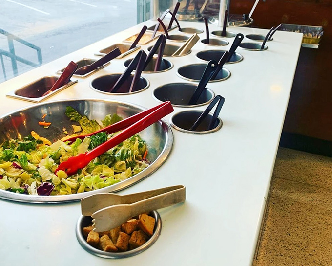 The salad bar setup isn't just fresh ingredients—it's a canvas of possibilities where you become the artist of your own leafy masterpiece.