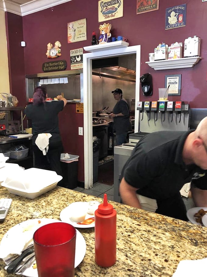 A glimpse into the kitchen reveals the organized chaos where breakfast dreams materialize – spatulas flashing like conductor's batons in a symphony of sizzle.