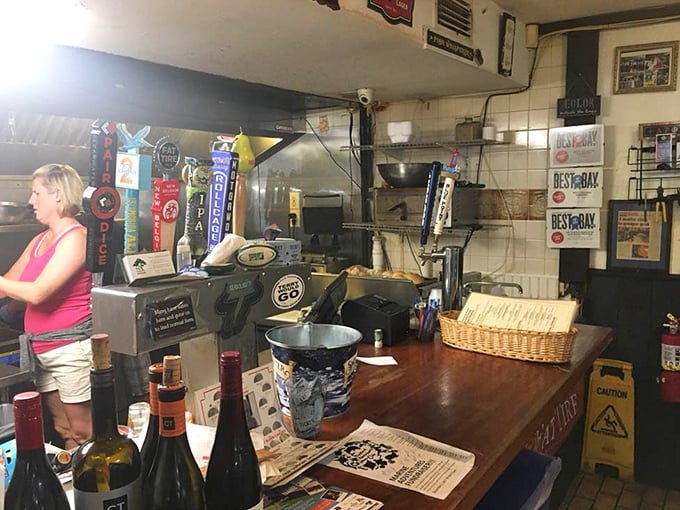 The controlled chaos of a kitchen that knows exactly what it's doing. Those "Best of Bay" awards aren't just decoration—they're well-earned bragging rights.
