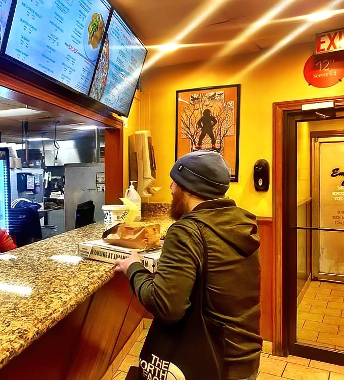 The ordering counter—that magical threshold where pizza dreams are spoken into existence by hungry patrons.