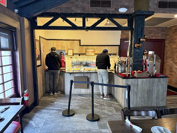 Where culinary dreams begin—the service counter promises delights that will soon transform your empty plate into a carnivore's canvas.