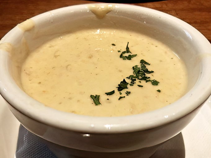 This velvety she-crab soup isn't just a starter—it's a warm embrace in a bowl, garnished with fresh herbs and good intentions.
