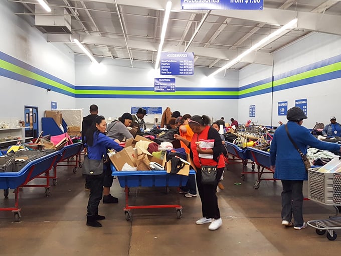 Behind the scenes magic—where donations transform into retail-ready treasures. These blue-vested wizards sort through yesterday's belongings to stock tomorrow's finds.
