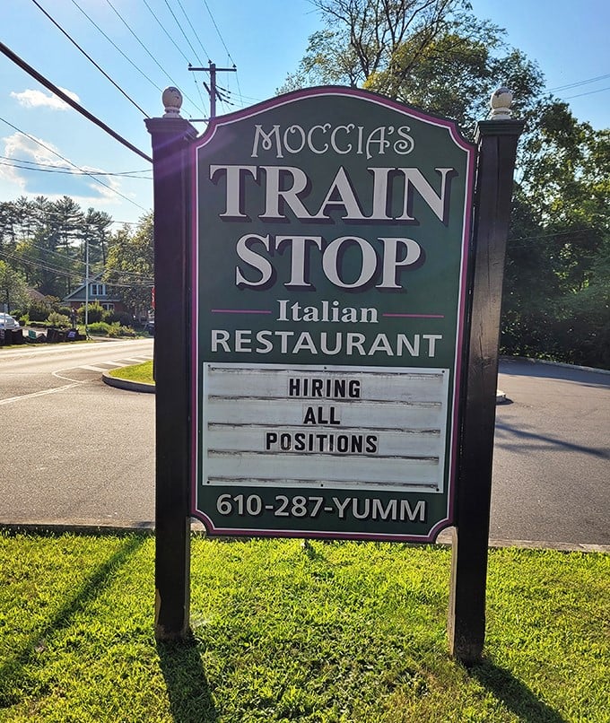 The sign doesn't just announce the restaurant—it promises a delicious detour from your regular routine with that perfect phone number: YUM-M.
