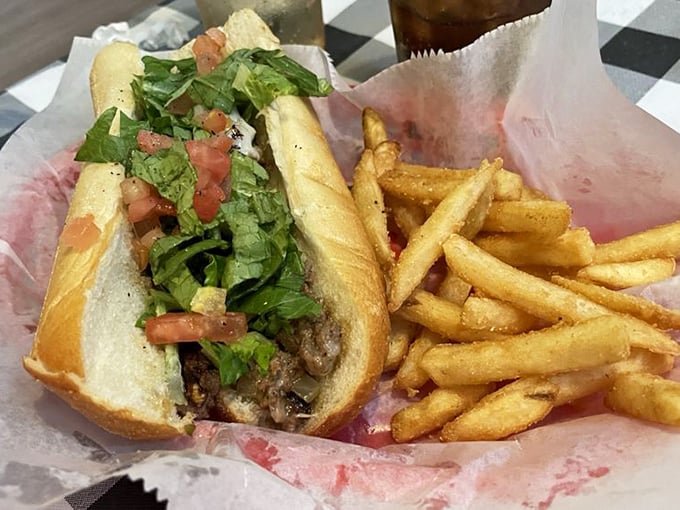 This chicken philly with fries isn't trying to reinvent the wheel—it's just making sure the wheel is absolutely delicious and served in a red basket lined with paper.