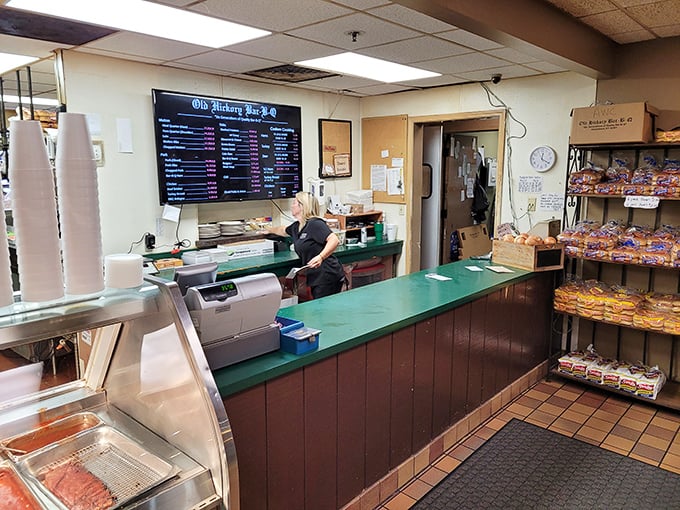 The ordering counter – where barbecue dreams begin and diet plans go to die. That menu board holds the secrets to happiness.