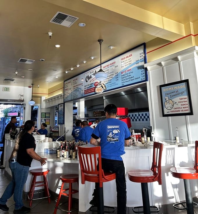 Staff in Chowder's blue shirts move with practiced precision, like seafood ballet dancers orchestrating a symphony of fried perfection.