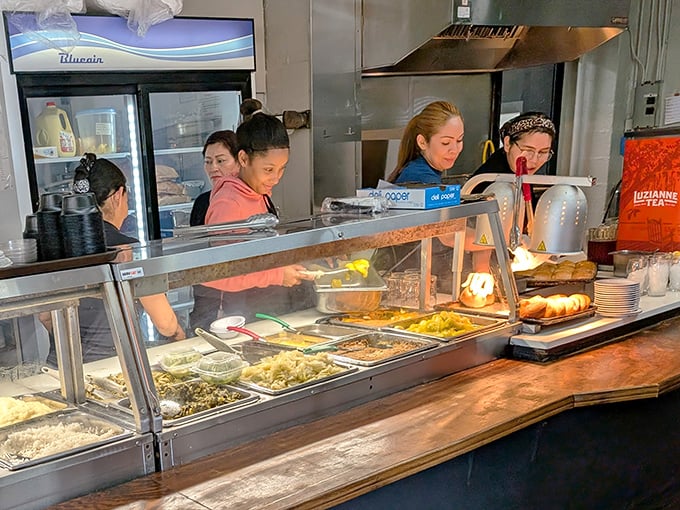 The serving line staff—culinary gatekeepers who know exactly how much gravy constitutes "a little extra" for each regular customer.